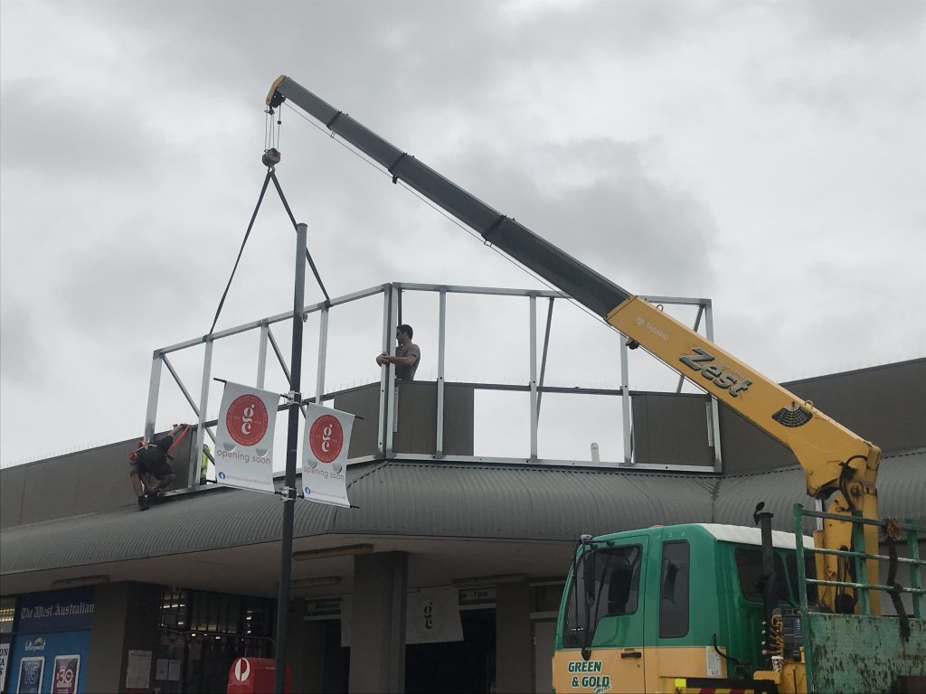 Signage Install - Green and Gold Hiab Hire